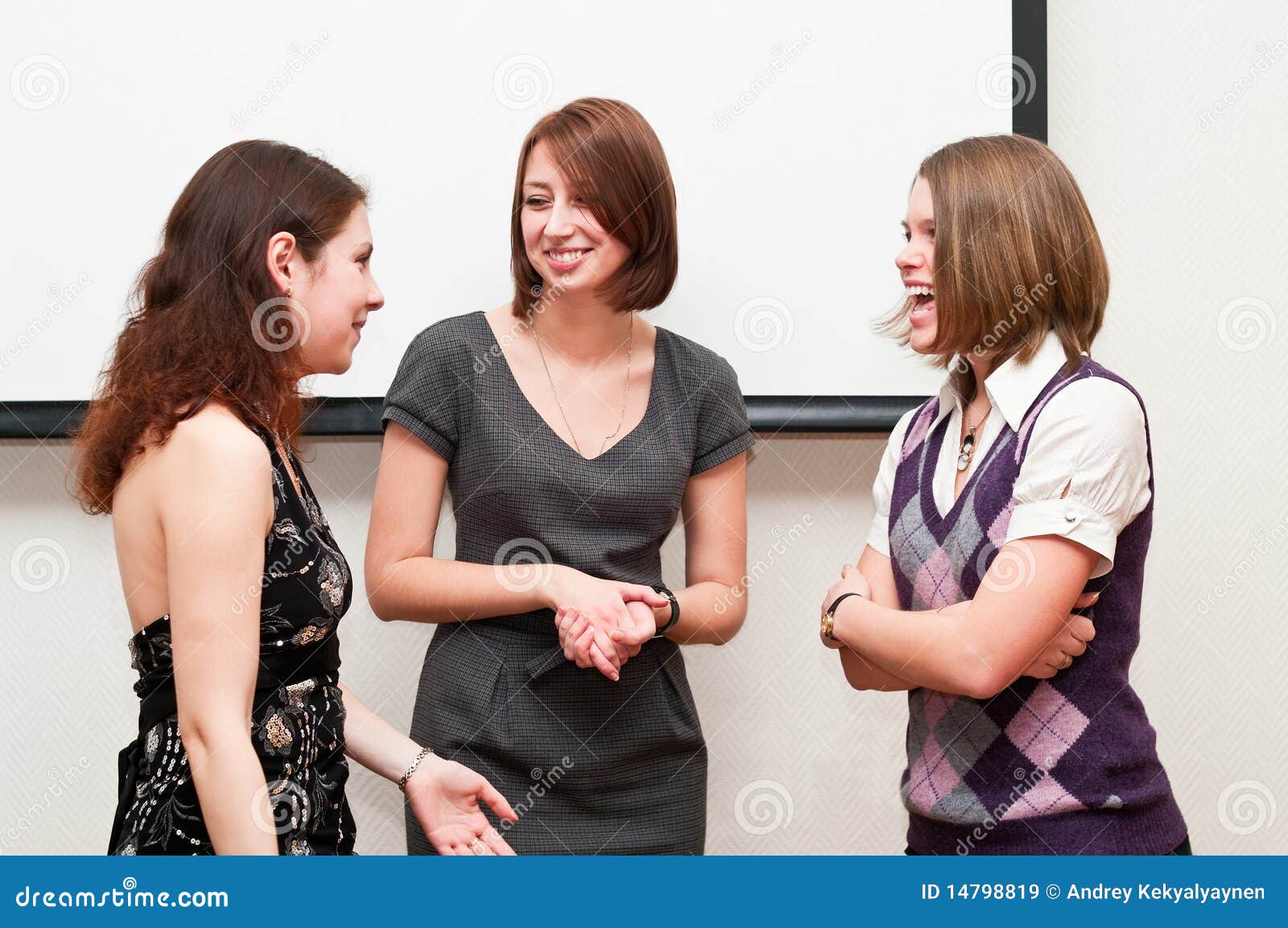 Three Students Talking in Classroom Stock Image - Image of explaining ...