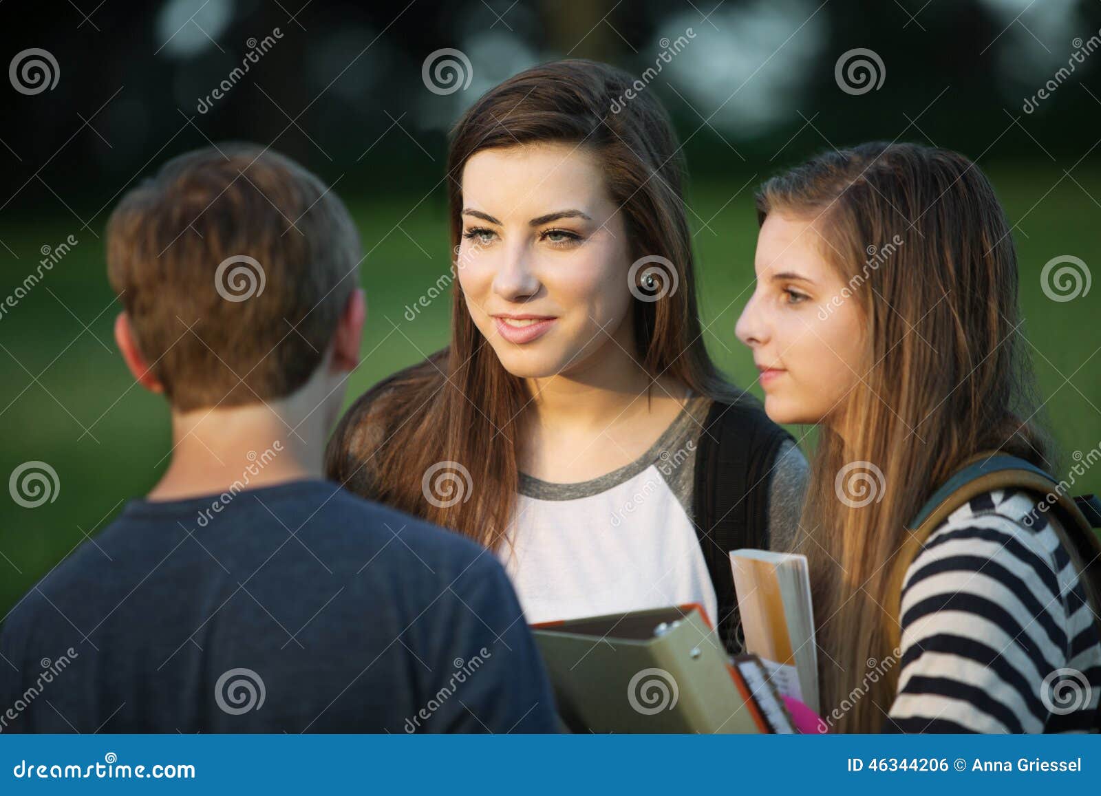 Three Students Talking Outdoors Stock Photo - Image of chatting ...