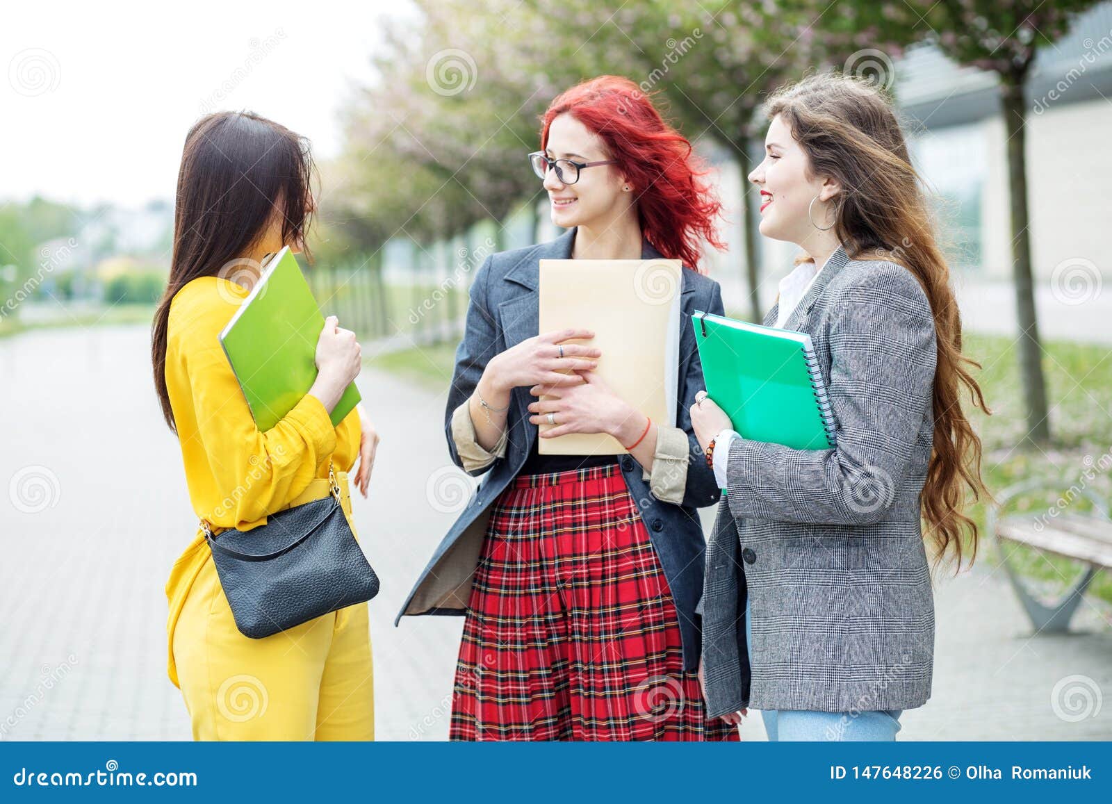 Three Students are Talking about Their Studies on the Campus. Education ...