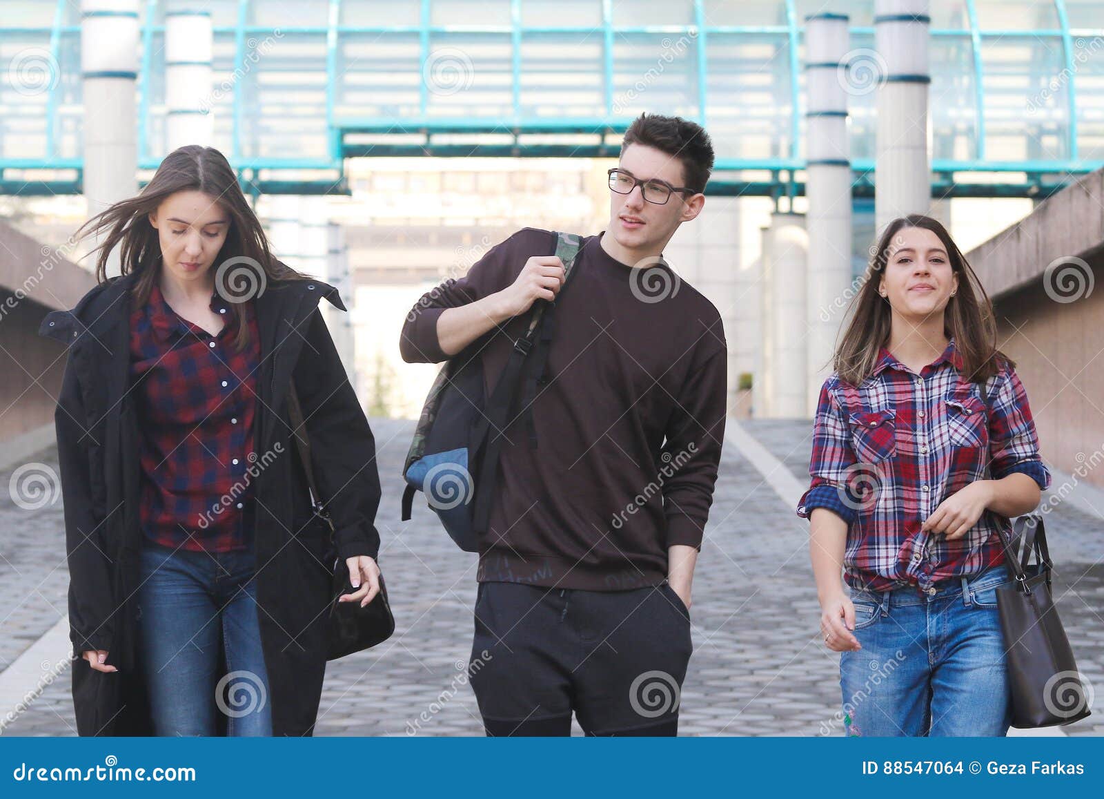 Three Students Walking in the Campus Stock Photo - Image of learn ...