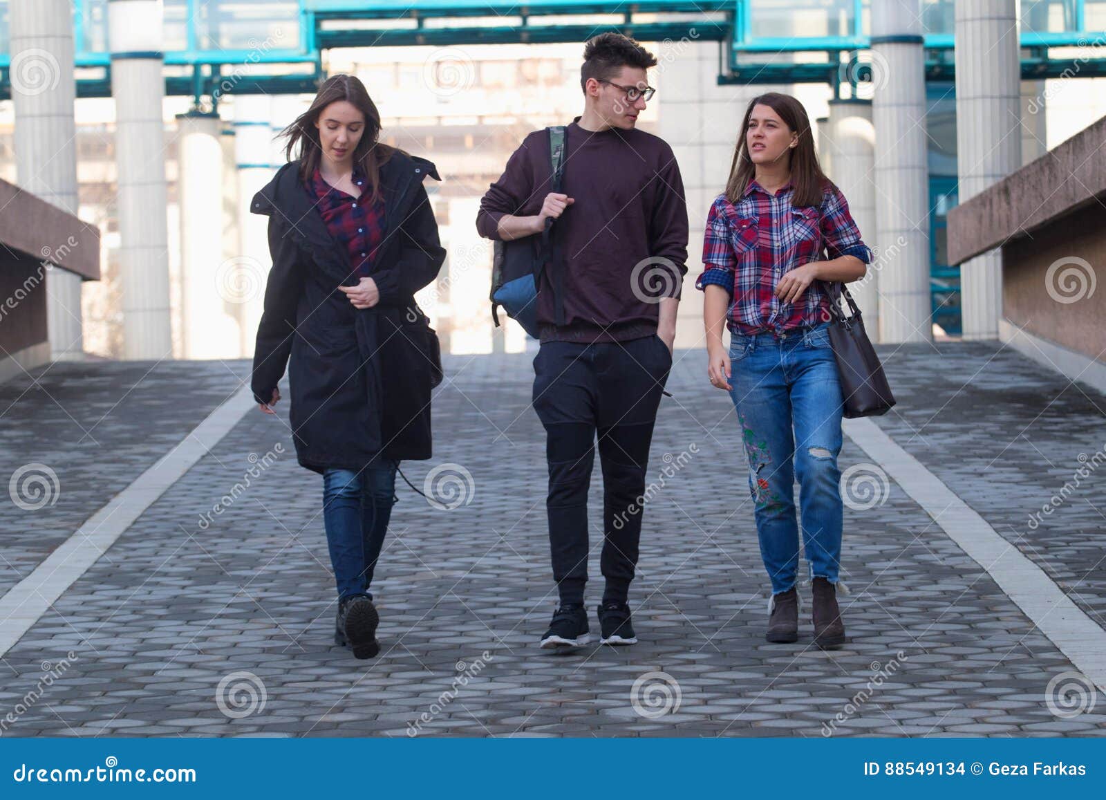 Three Students Walking in the Campus Stock Photo - Image of male ...