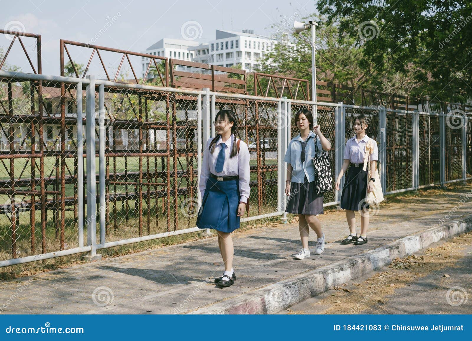 Three Students Walking Home Together Stock Image - Image of group ...