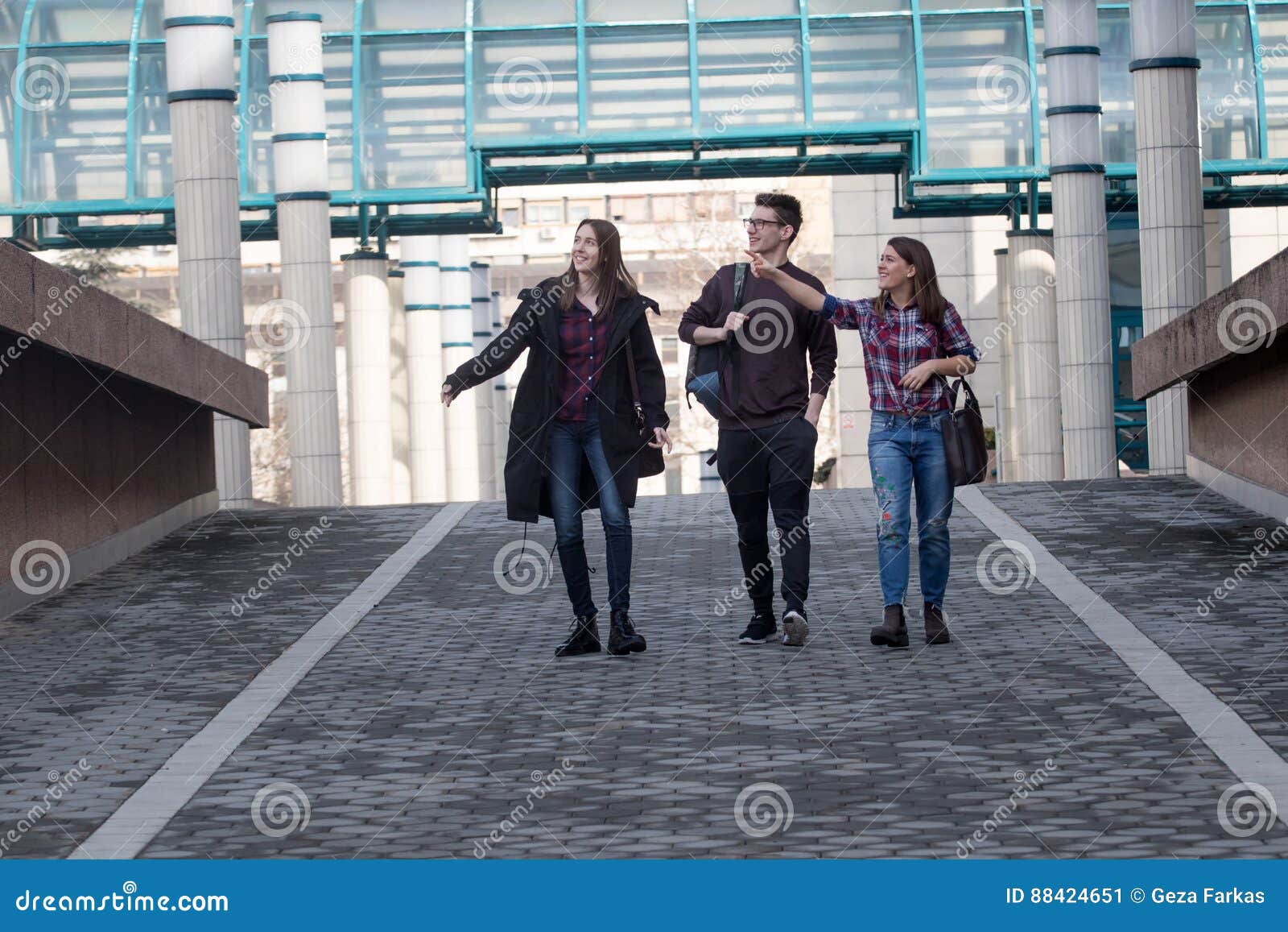 Three Students Walking and Smiling Stock Image - Image of students ...
