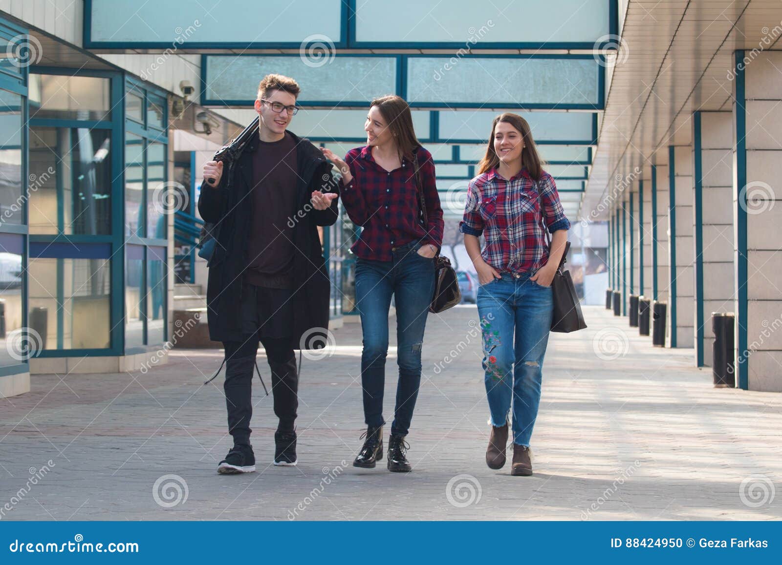 Three Students Walking and Smiling Stock Photo - Image of teenager ...