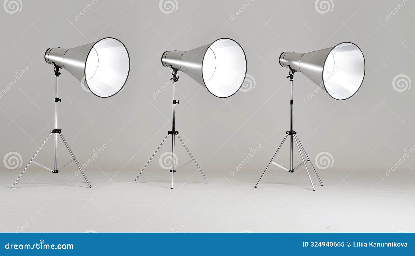 Three Studio Lights with Diffuser Reflectors are Mounted on Tripods and ...