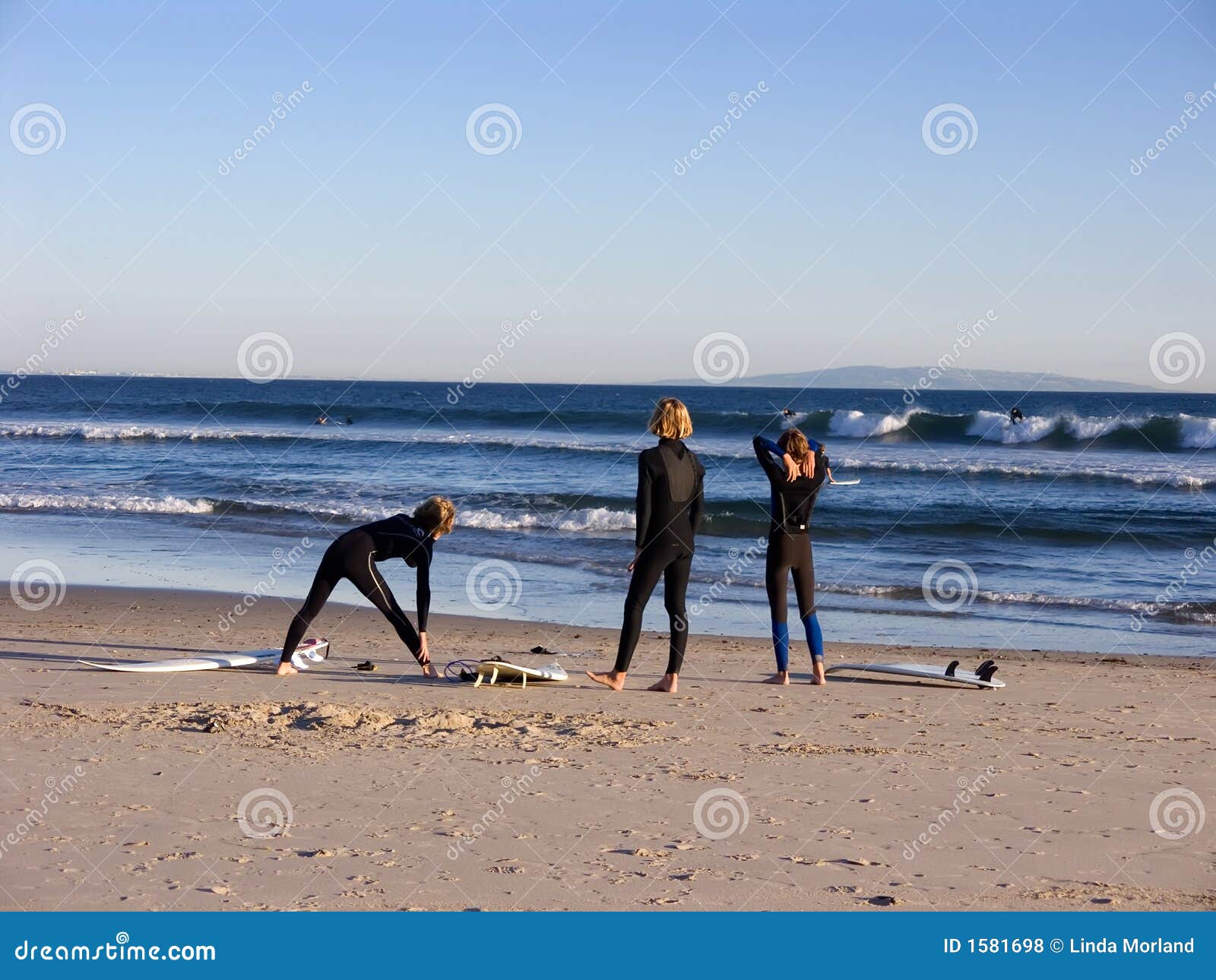 Three surfers stock photo. Image of woman, water, black - 1581698