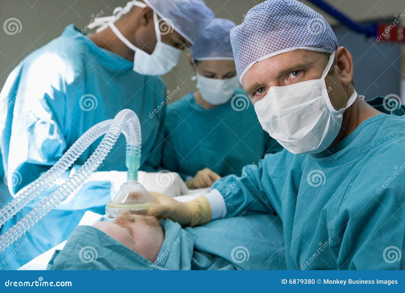 Three Surgeons Operating on a Patient Stock Photo - Image of equipment ...