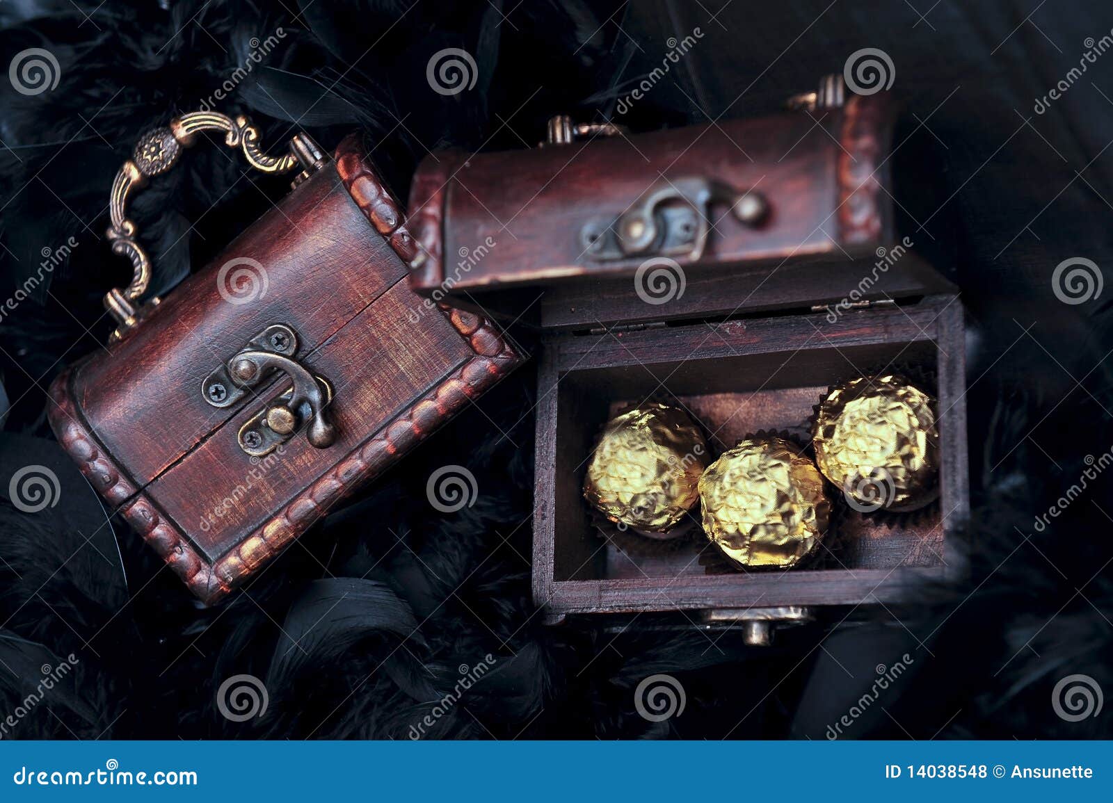 Three Sweets In Small Open Treasure Chest Picture. Image: 14038548