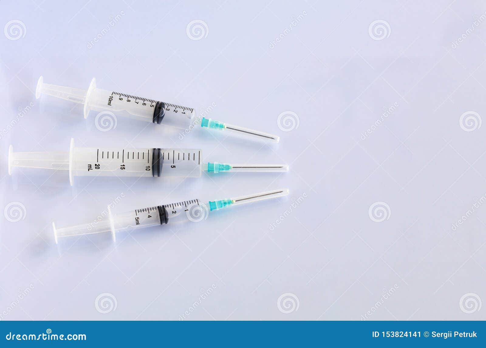 Several Different Syringes on a White Smooth Table are Filled with ...