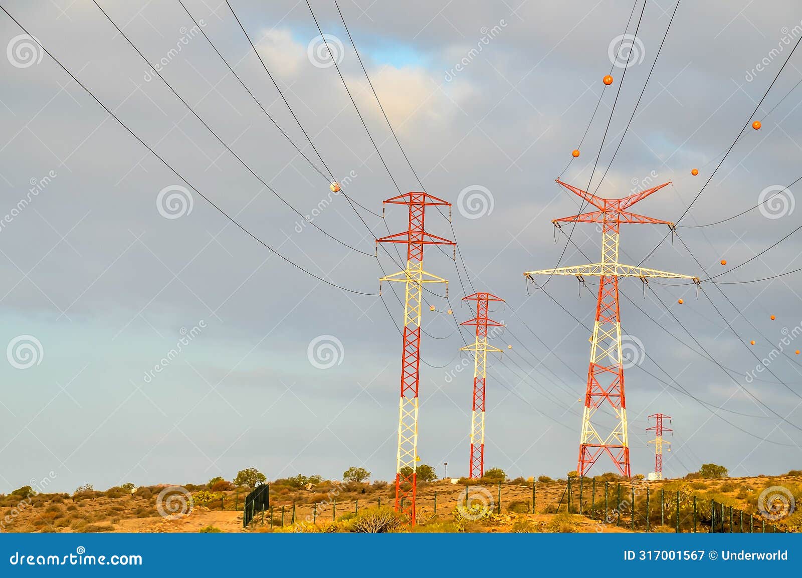 Three Tall Red and White Power Lines are in the Sky Stock Image - Image ...