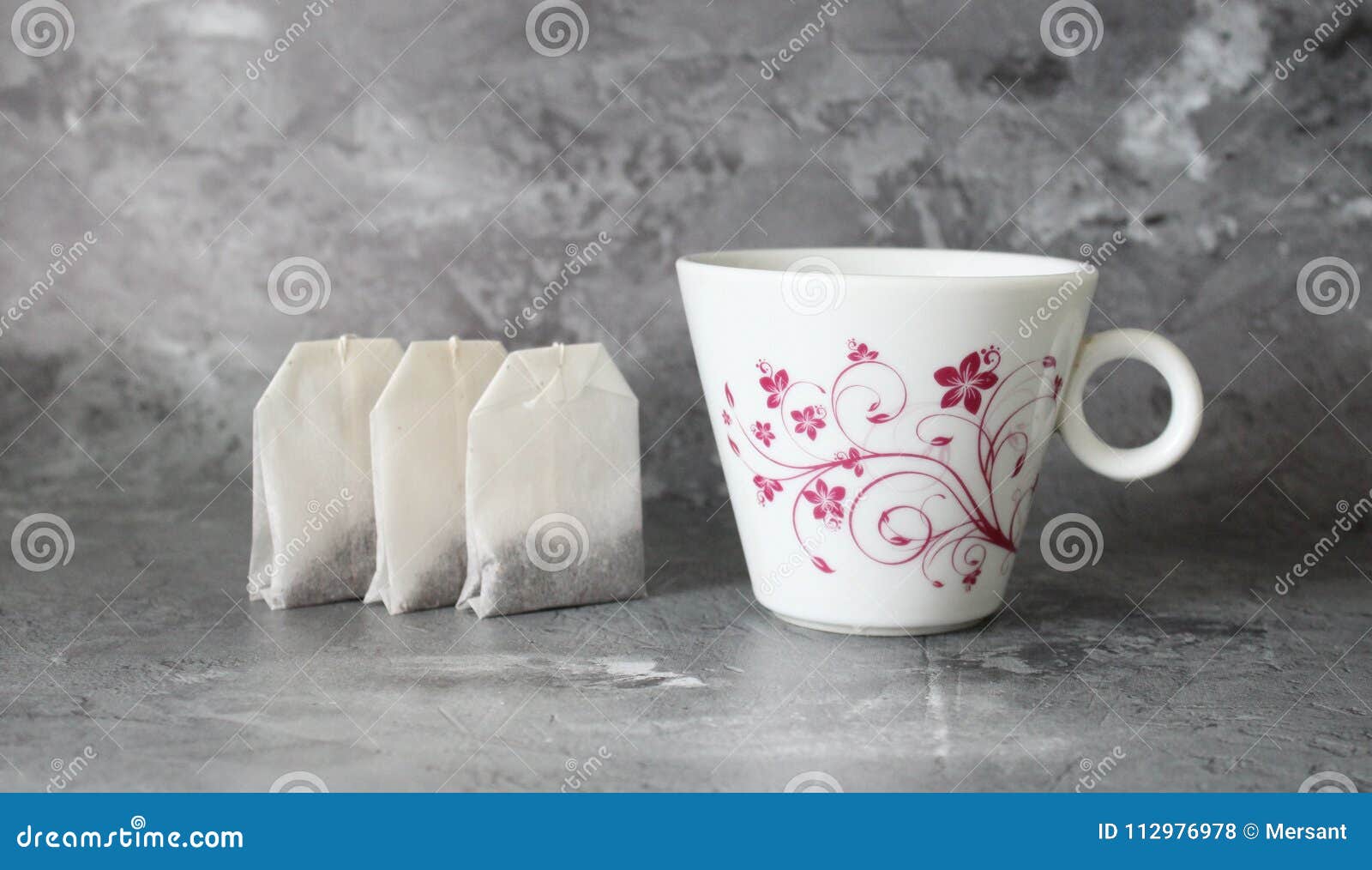Three tea-bags and cup stock photo. Image of fine, drinking - 112976978