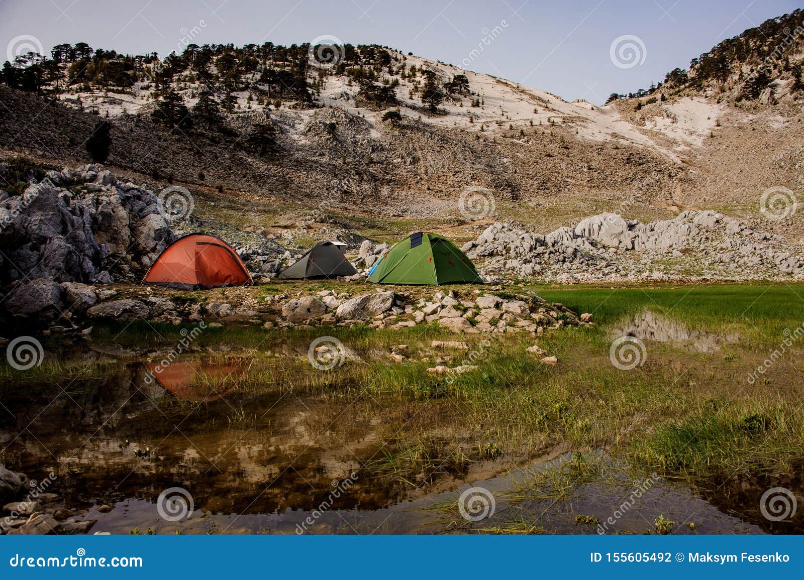 Three Tents Standing in Valley in Mountains Stock Photo - Image of tour ...