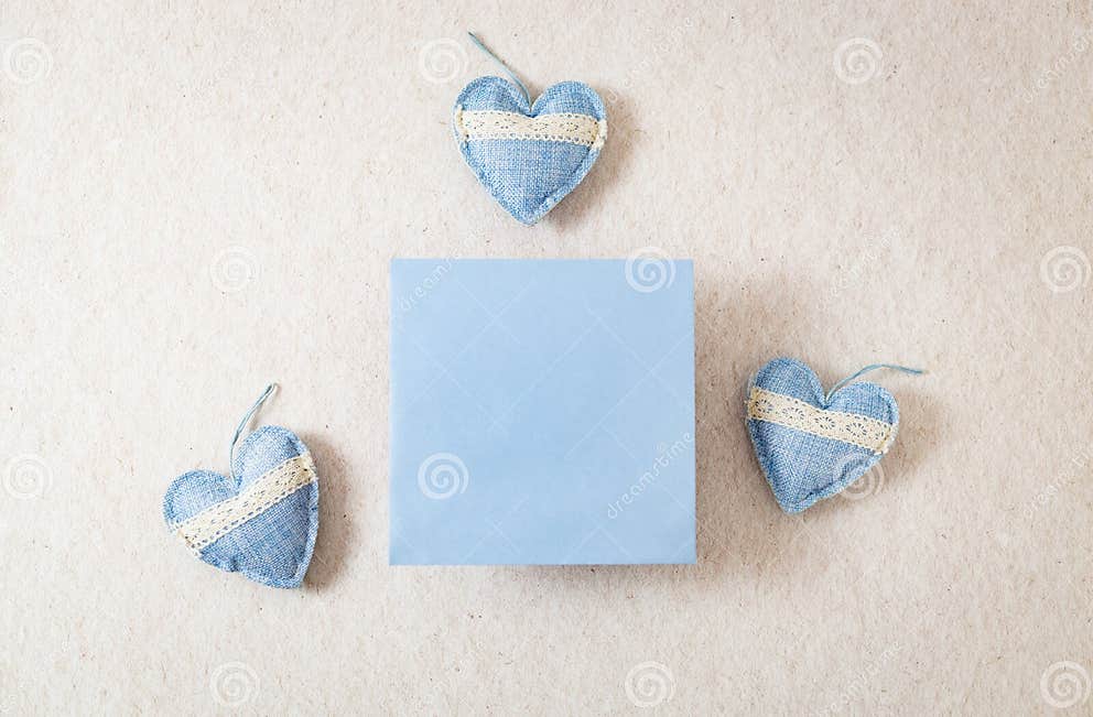 Three Textile Hearts and an Empty Sheet on a Stone Background. Stock ...
