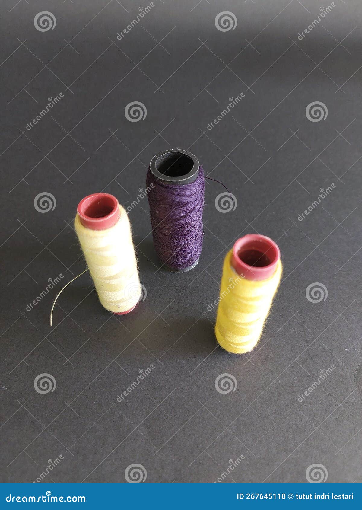 Three Threads of Various Colors, Yellow Purple and Cream Stock Photo ...