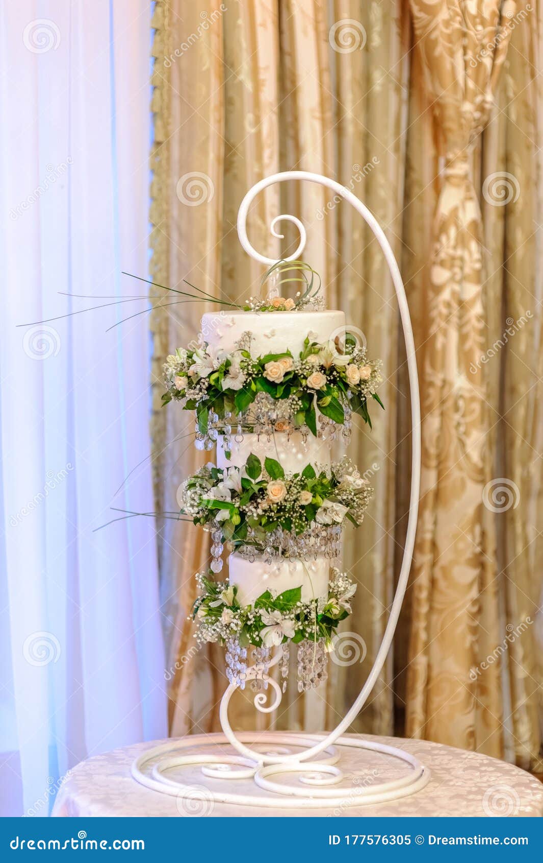 Three-tier Hanging Cake with Floral Decorations Stock Image - Image of ...