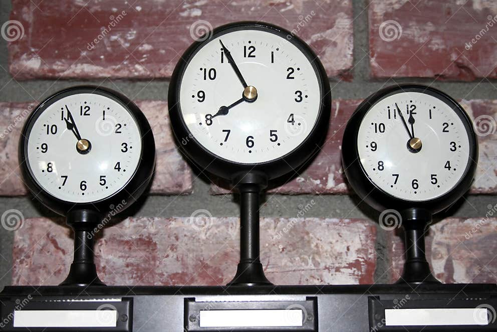 Three time zone clock stock image. Image of alarm, table - 1241467