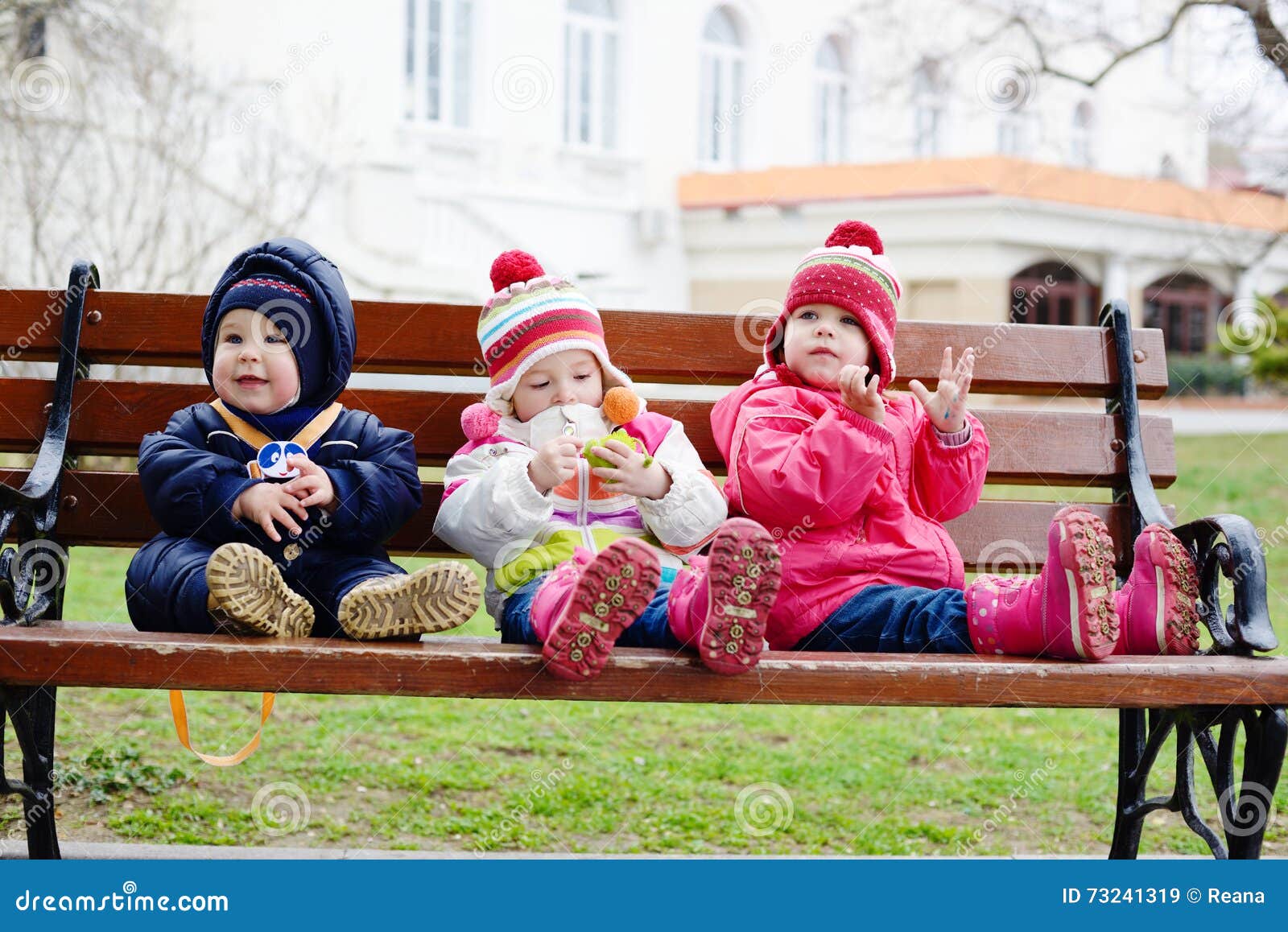 Three Toddlers on the Bench Stock Image - Image of holiday, family ...