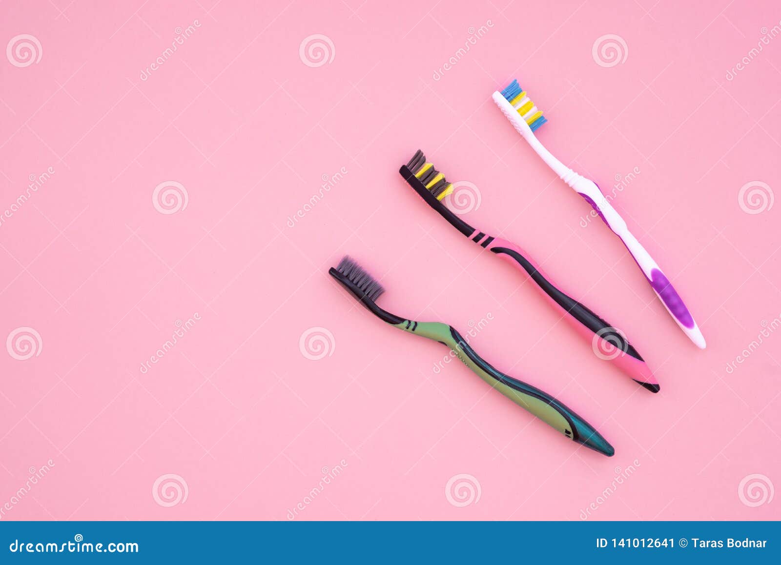 Three Toothbrushes are Isolated on a Pink Background, Copyspace. Flat ...