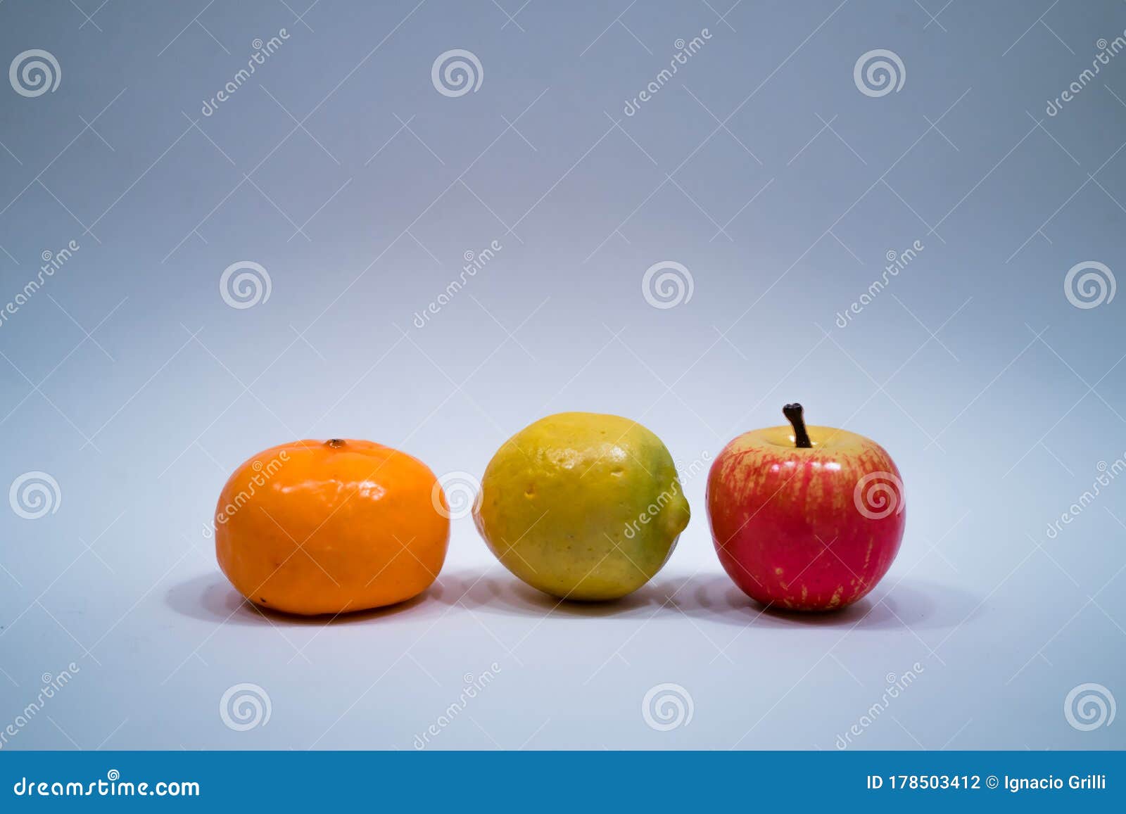 Three Toy Fruits on Light Blue Background Stock Photo - Image of exotic ...