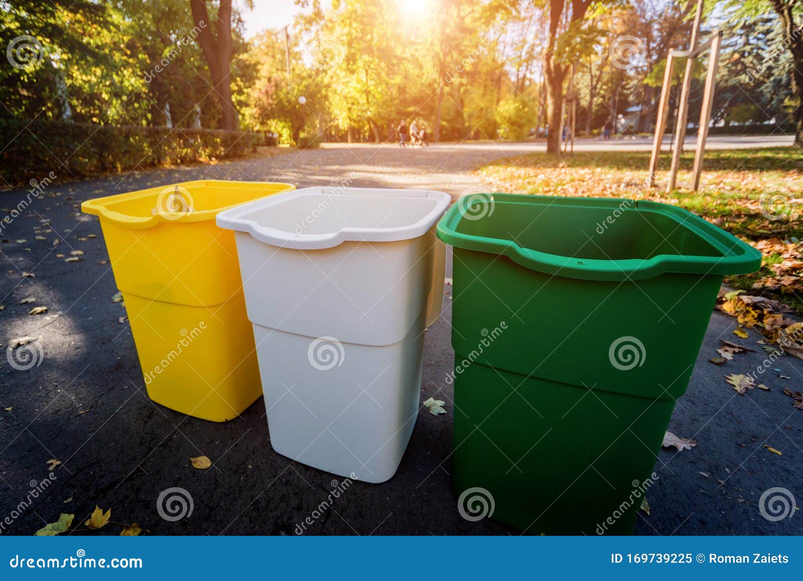 Three Trash Containers in Different Color, for Sorted Waste. Outdoors ...