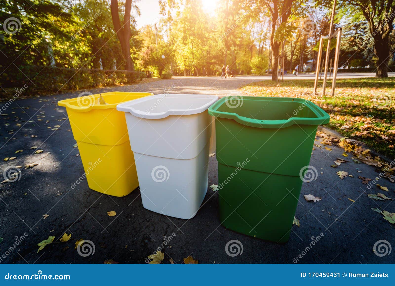 Three Trash Containers in Different Color, for Sorted Waste. Outdoors ...