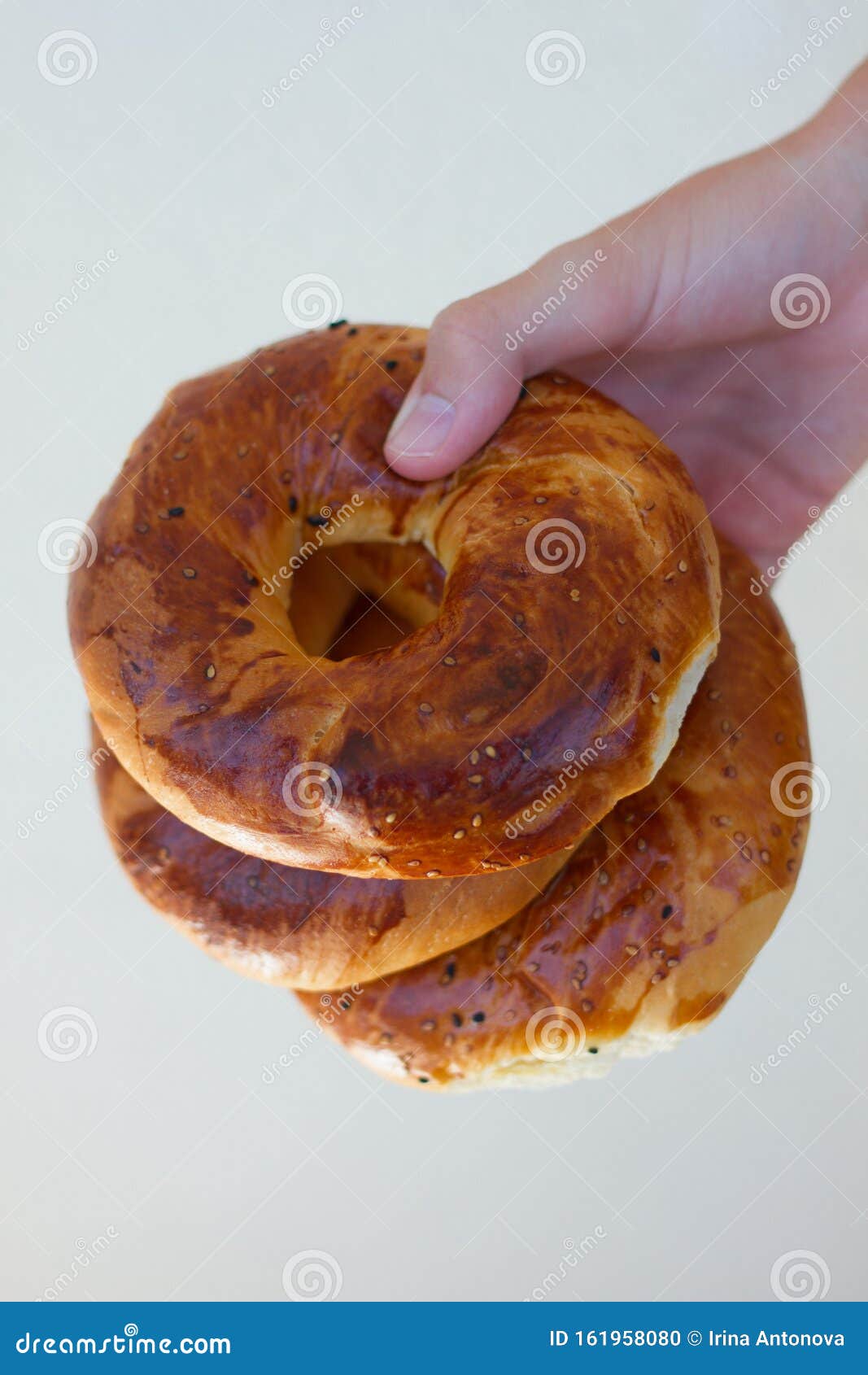 Three Turkish Achma Bagels in Man`s Hands, Bagels from Bakery Stock ...