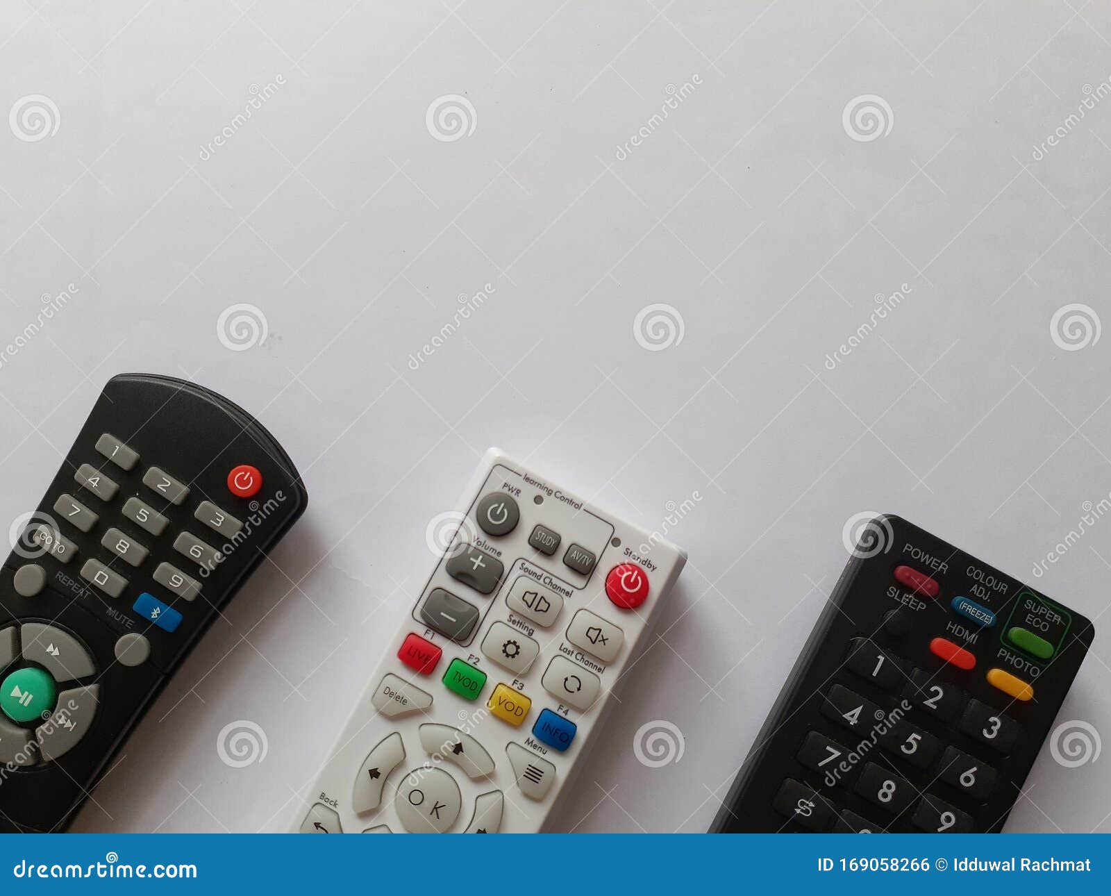 Three Tv Remote in White Background Stock Photo - Image of channel ...