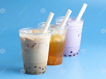 Three Different Types of Boba Tea on a Bright Blue Background Stock ...