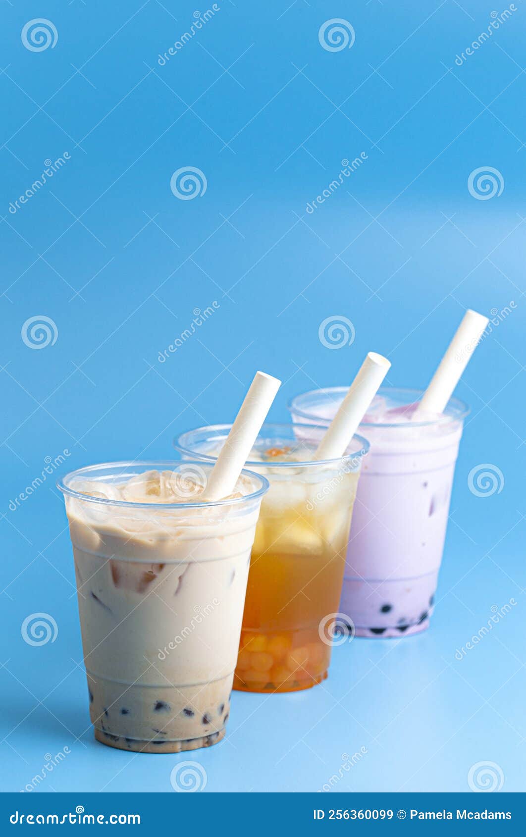 Three Different Types of Boba Tea on a Bright Blue Background Stock ...