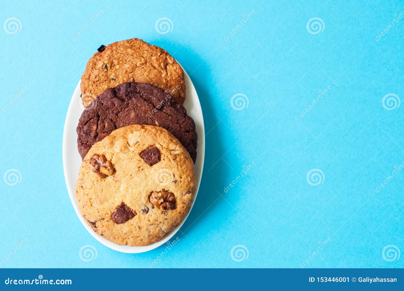 Three Types of Cookies in a Plate on a Blue Background Stock Image ...