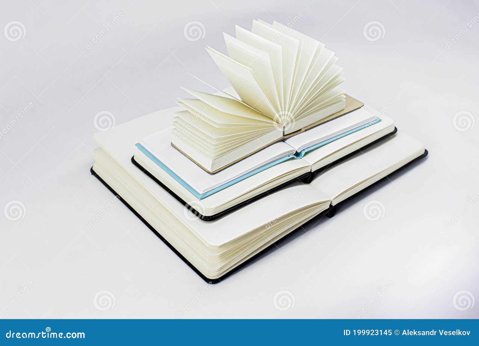 Three Unfold Notebooks Lie on Top of Each Other and Fan Open Small ...