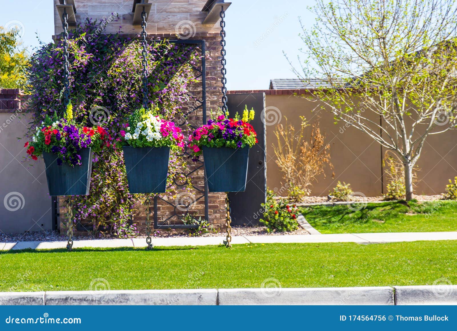 Three Unique Flower Containers Suspended by Chains Stock Photo - Image ...
