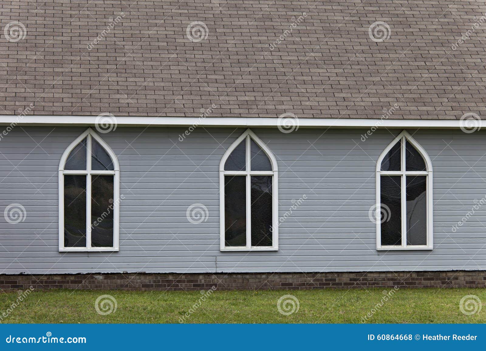 Three Uniquely Shaped Windows in a Row Stock Photo - Image of detail ...