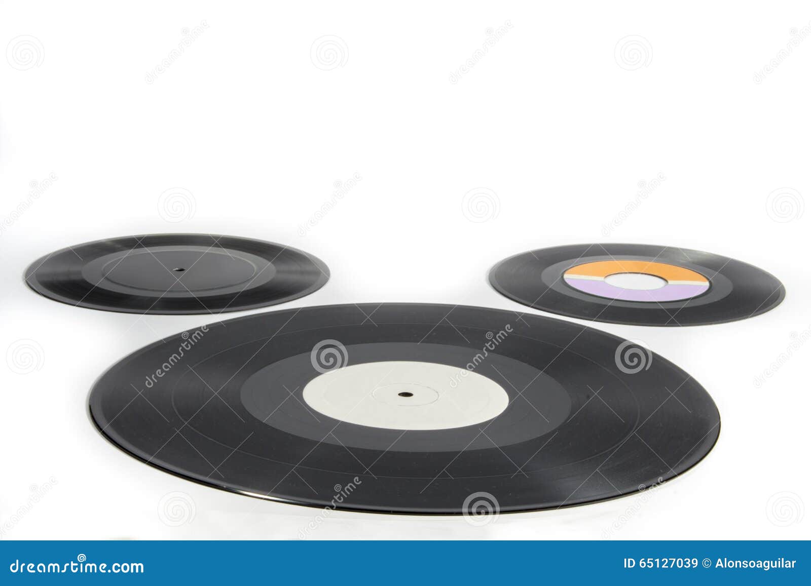 Three Vinyl Records of Different Sizes on White Background Stock Image ...