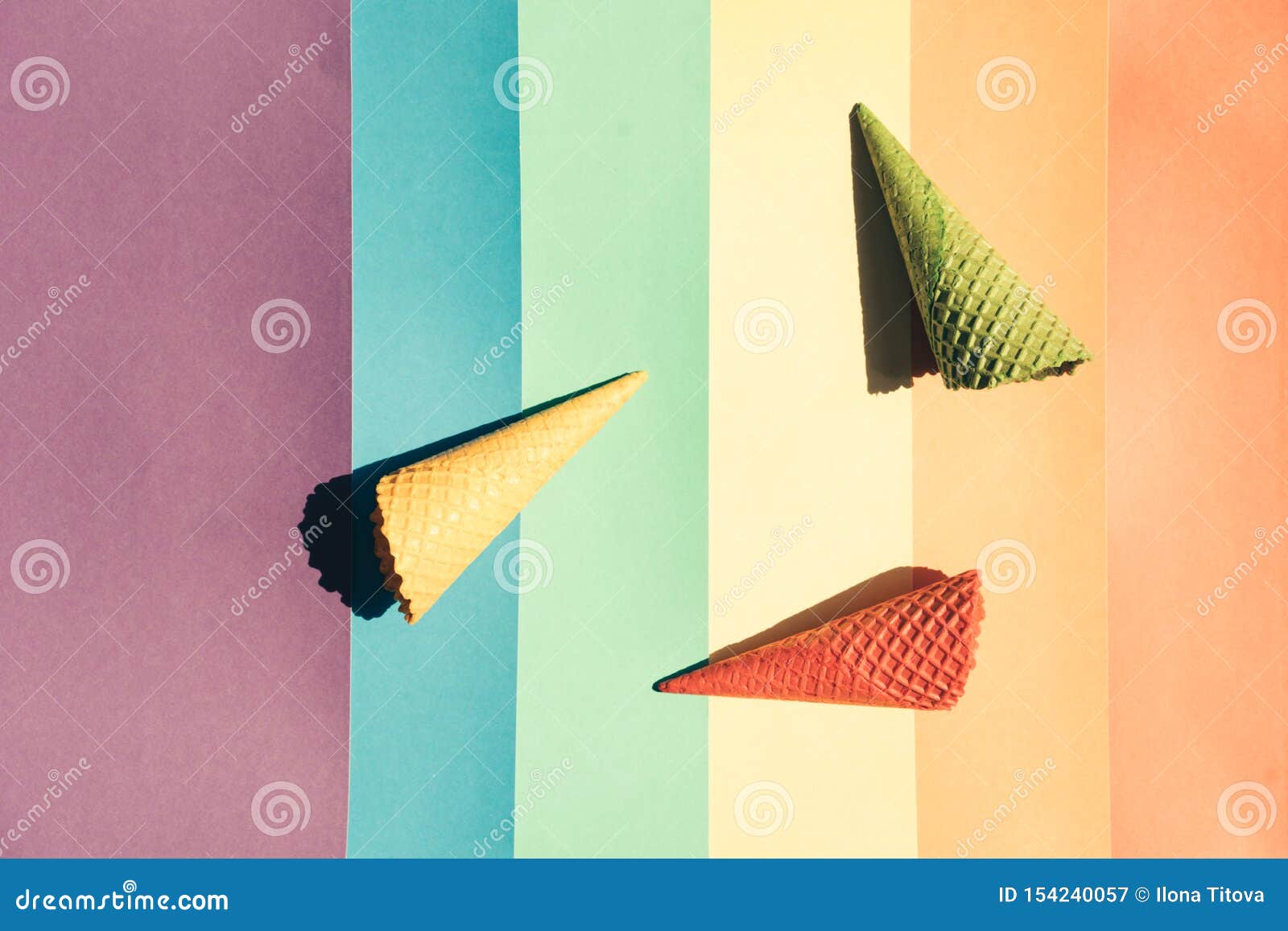 Three Wafer Cones on a Rainbow Paper Striped Background. Stock Image ...