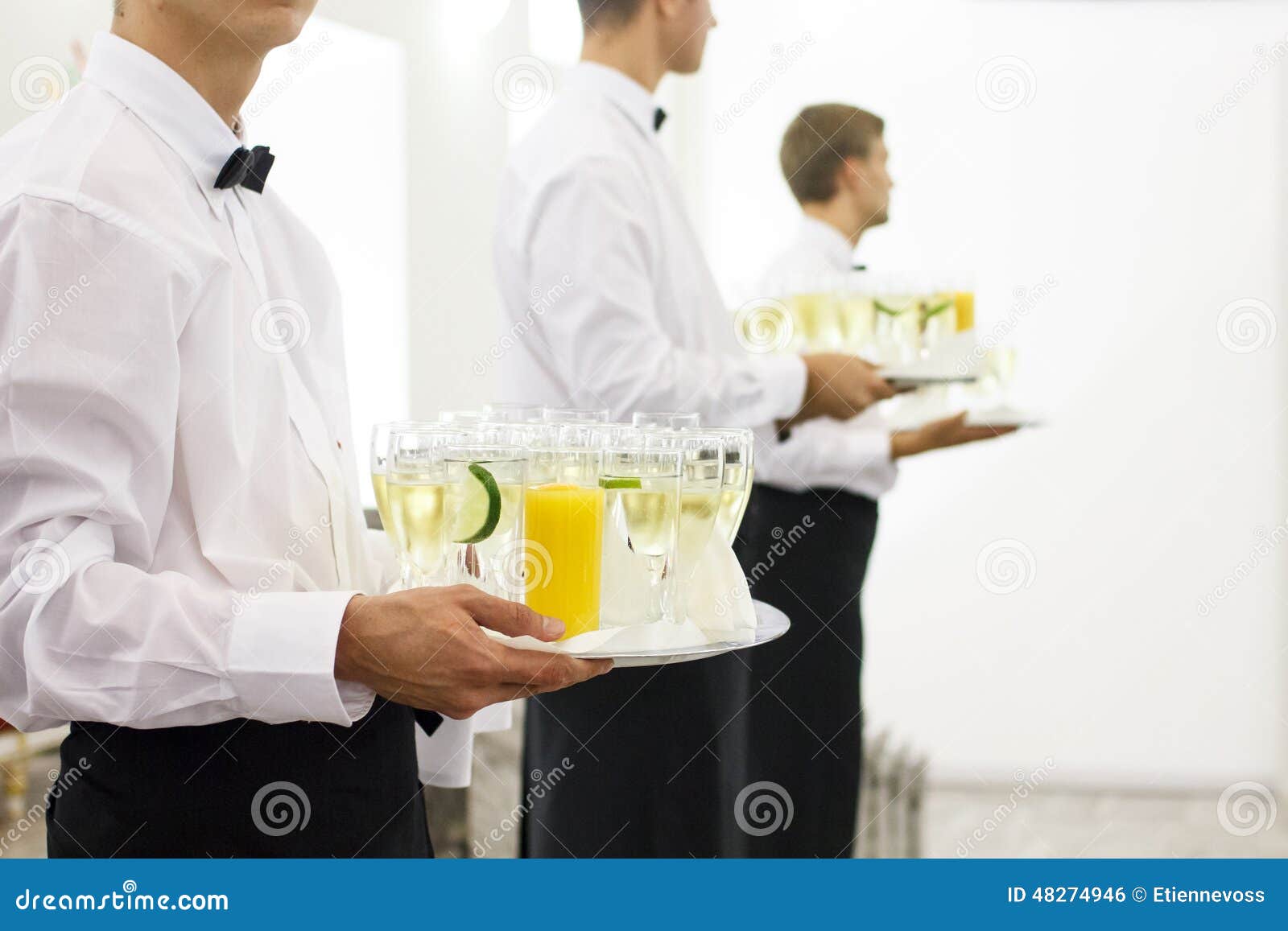 Three Waiters in Bow Ties Holding Trays. Stock Photo - Image of person ...