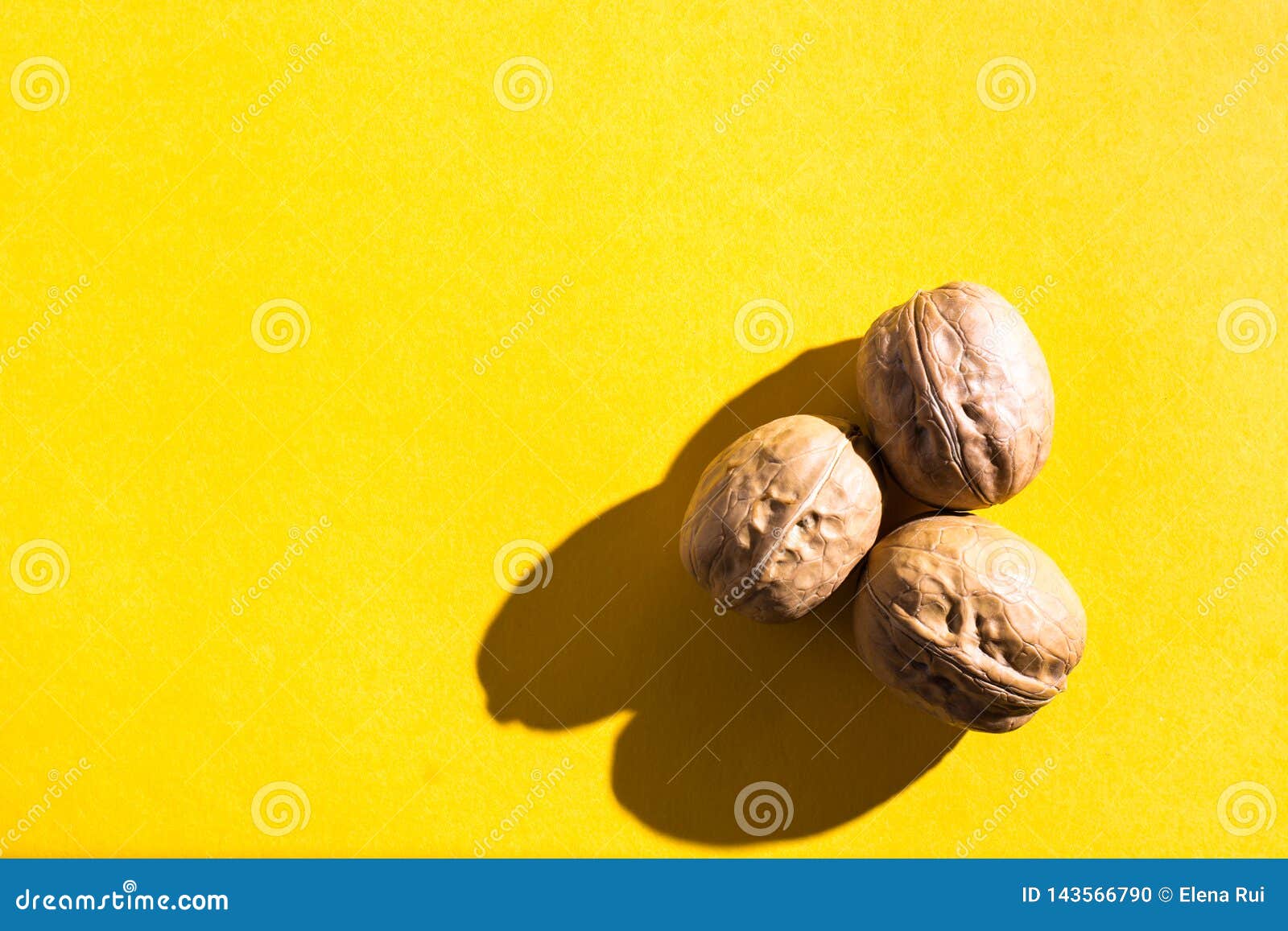 Three Walnuts are on a Yellow Cardboard Stock Photo - Image of diet ...