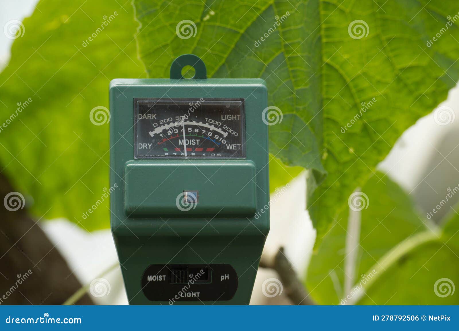 Three Way Meter PH, Light and Moisture in the Soil Stock Photo - Image ...