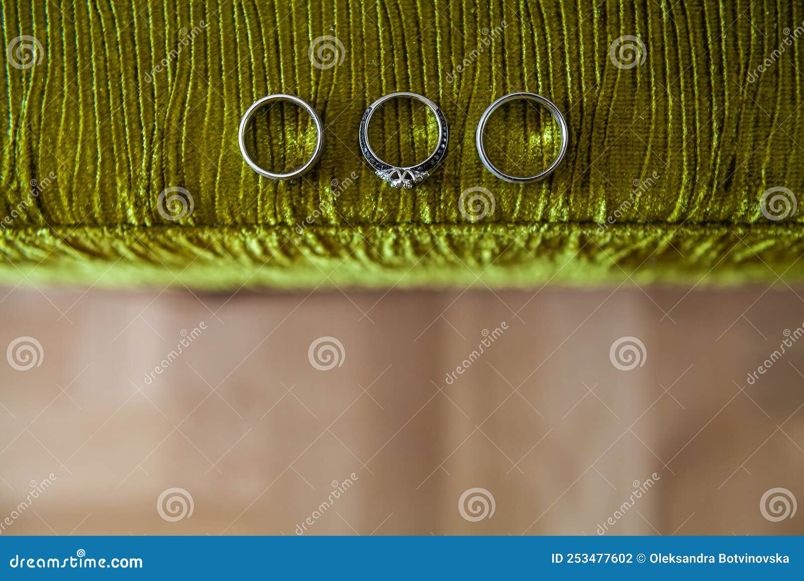 Three Wedding Rings on a Green Sofa Stock Photo - Image of fashion ...