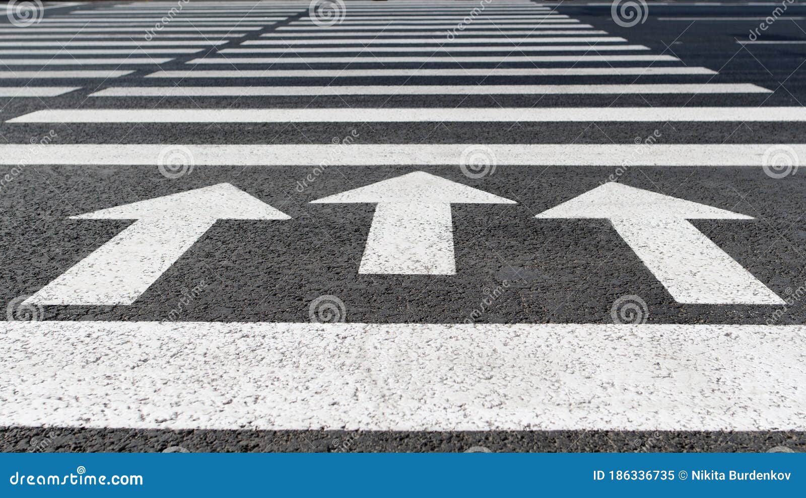 Three White Arrows on the Pavement Stock Image - Image of black ...