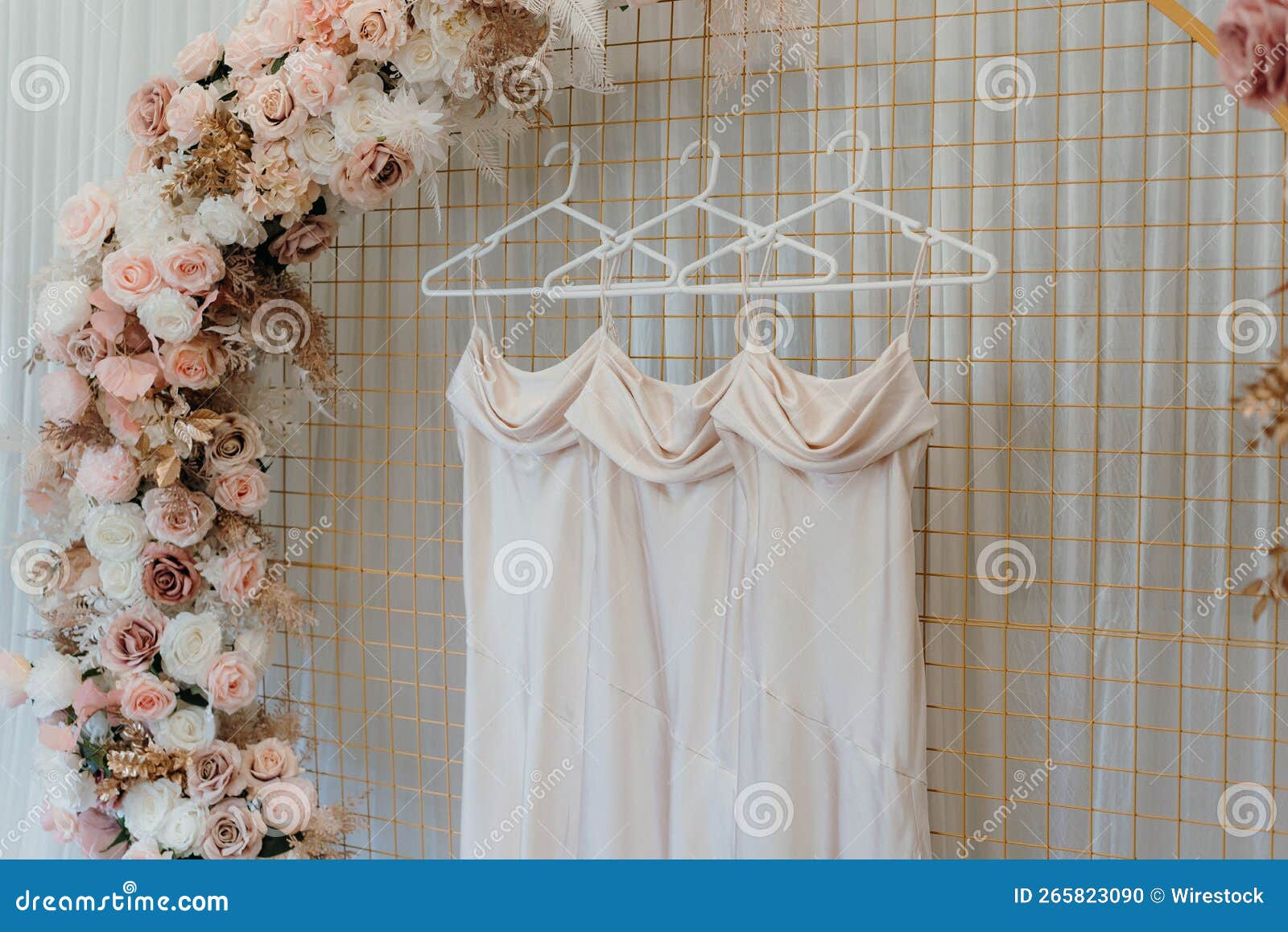 Three White Elegant Dresses on the Hangers Stock Photo - Image of ...