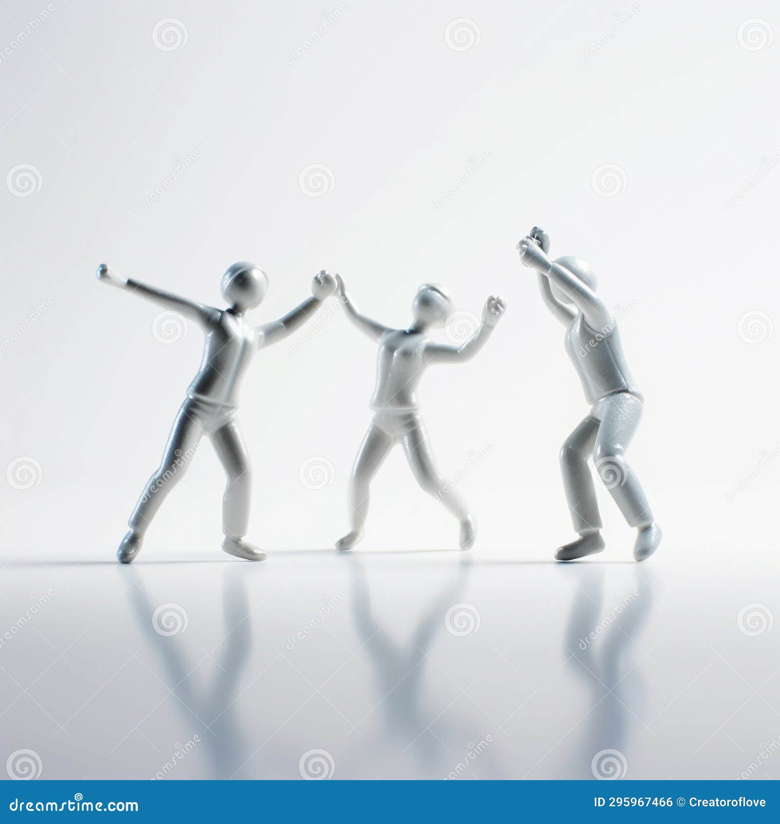 Three White Miniature People Dancing on White Background Stock ...