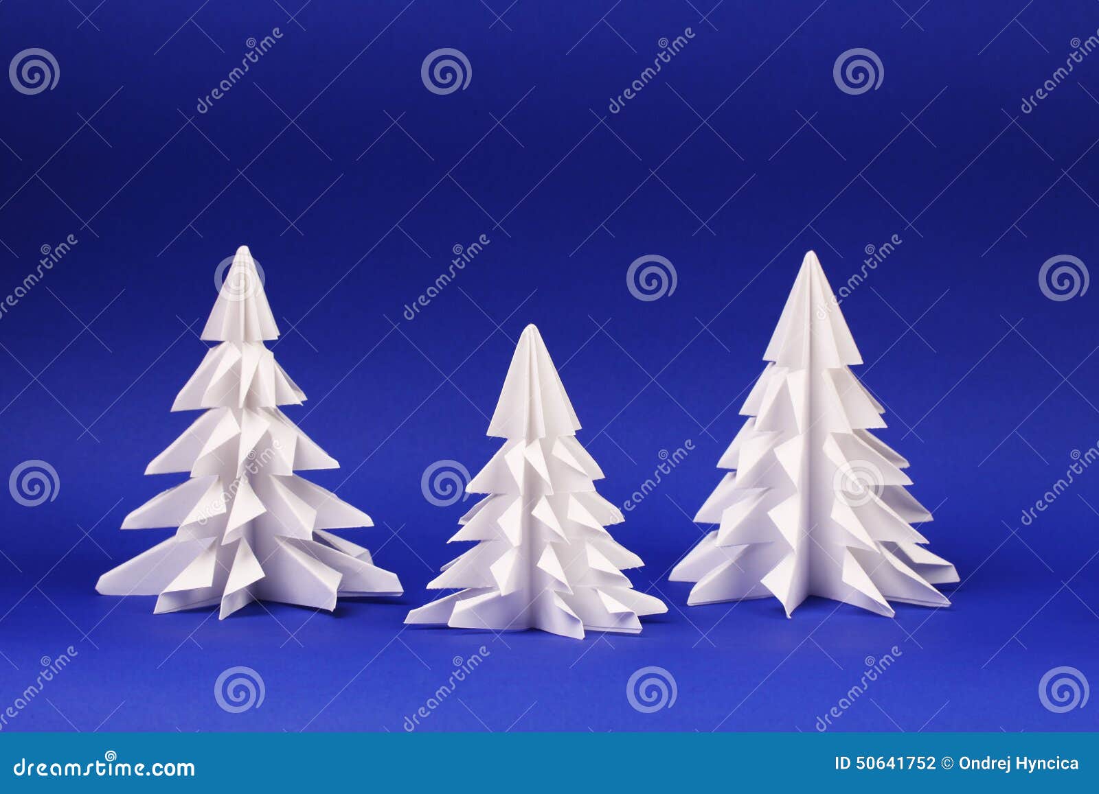 Three White Paper Trees on Blue Background Origami Trees Stock Photo ...
