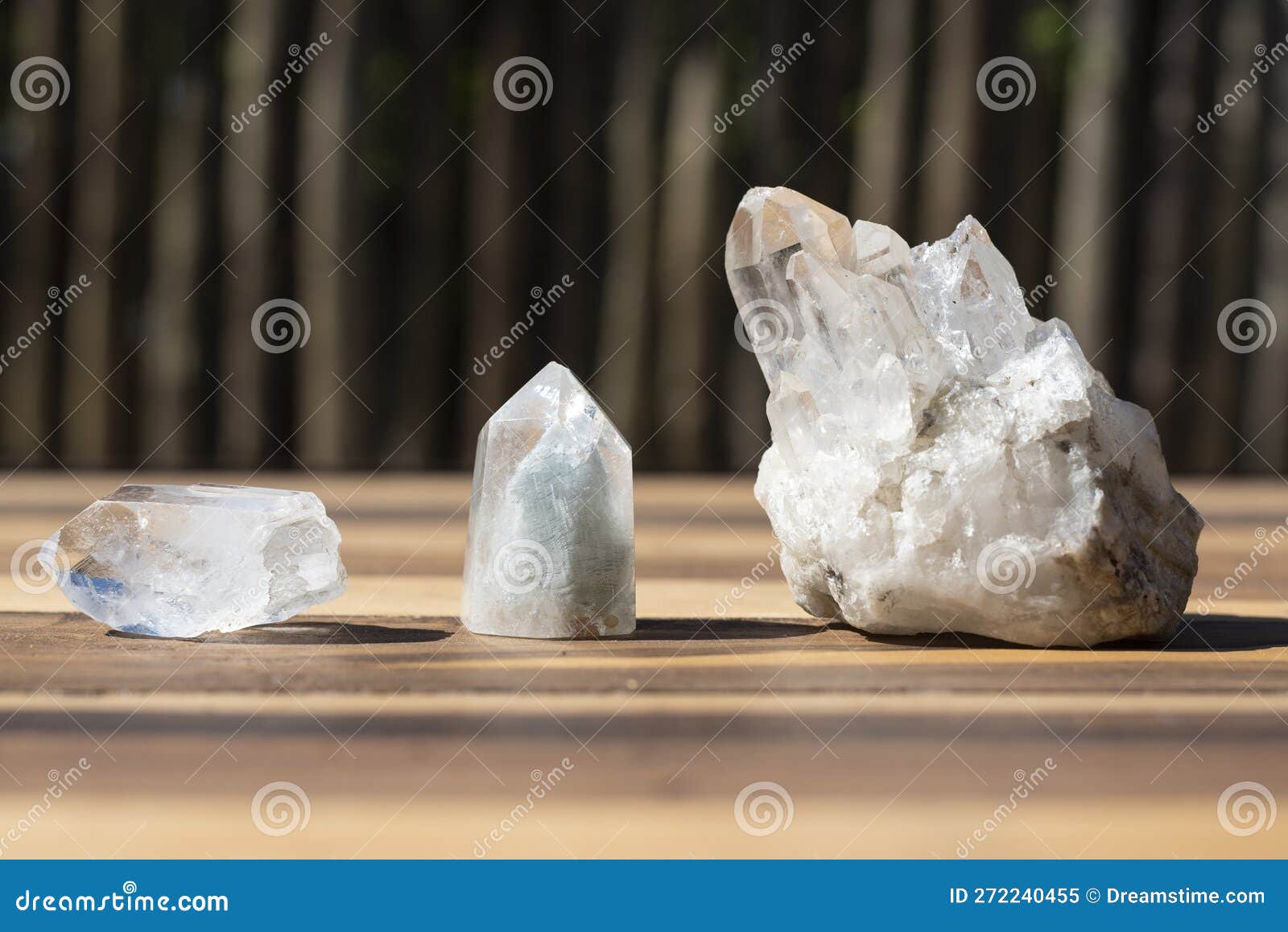 Three White Quartz Crystals on a Table Stock Image - Image of ...