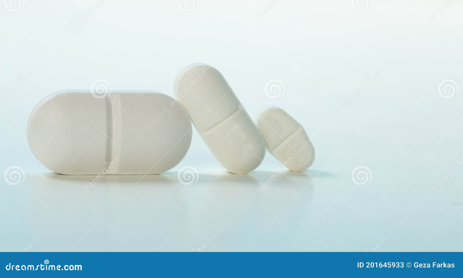 Three White Tablets of Different Sizes, Dosage Stock Image - Image of ...