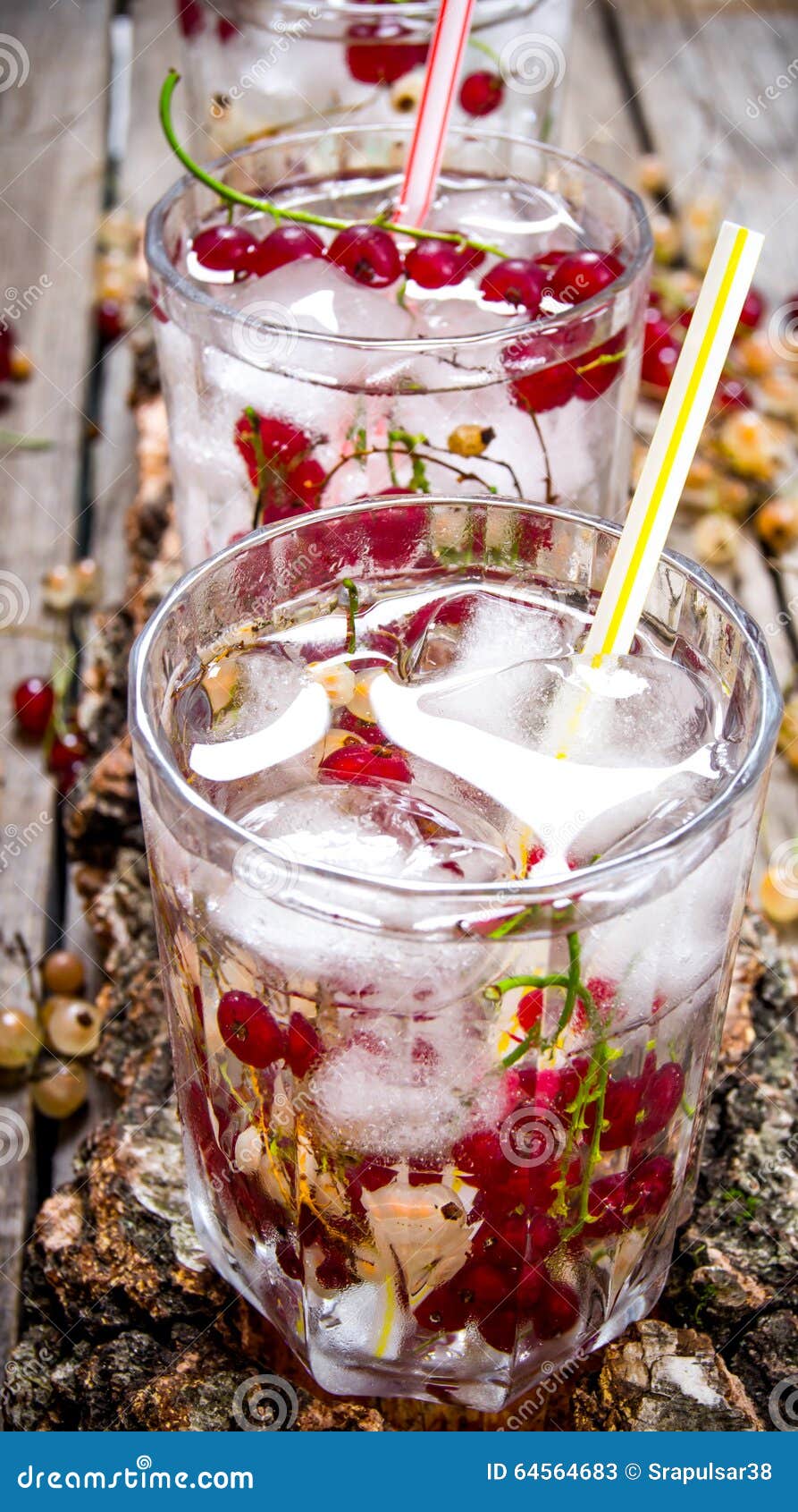 Three Wild Currant Cocktail with Ice on a Wooden Table. Stock Image ...