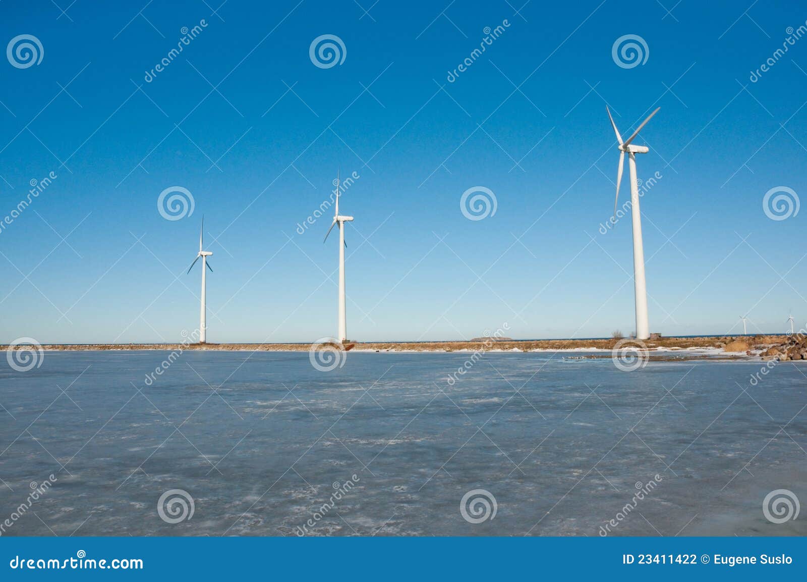 Three Windmills Near Frozen Lake Stock Photo - Image of line, cloud ...