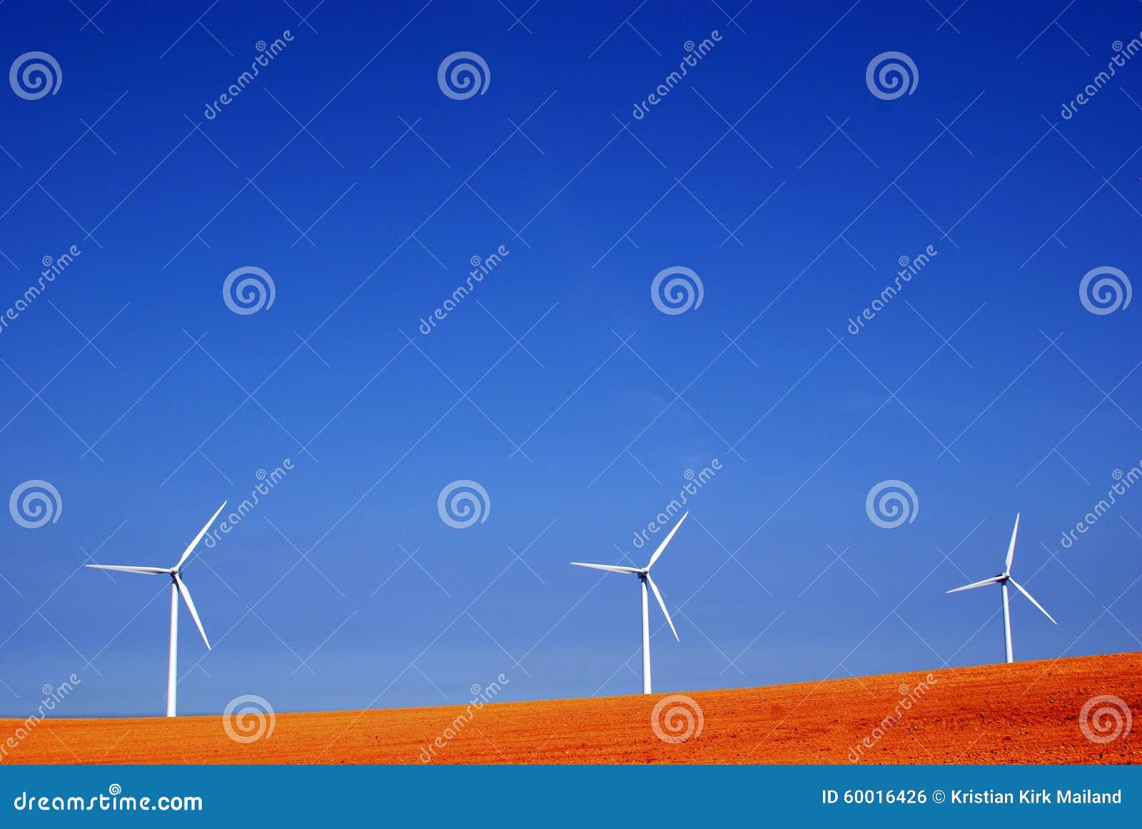 Three Windmills in Red Soil Stock Photo - Image of windmills, turbine ...