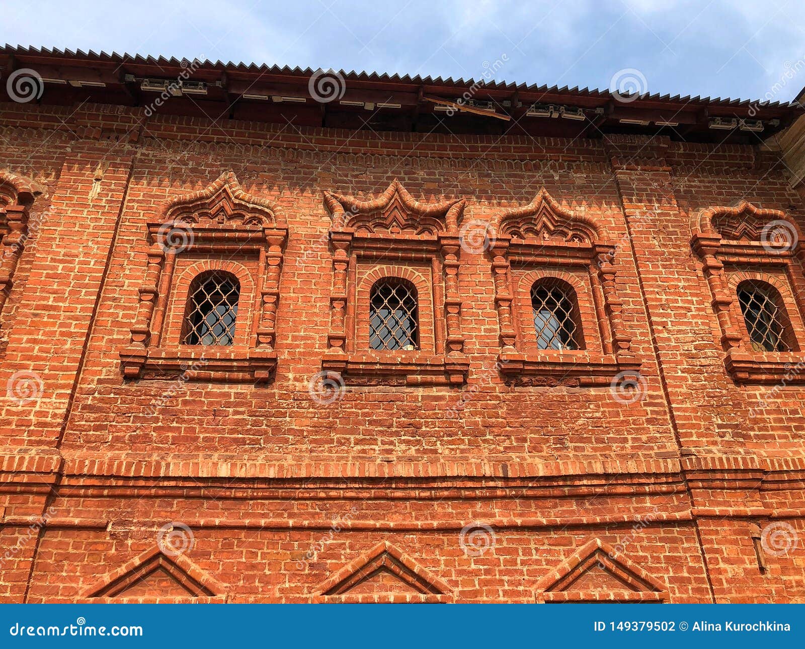 Windows with a Stone Pattern on the Background of a Red Brick Wall ...