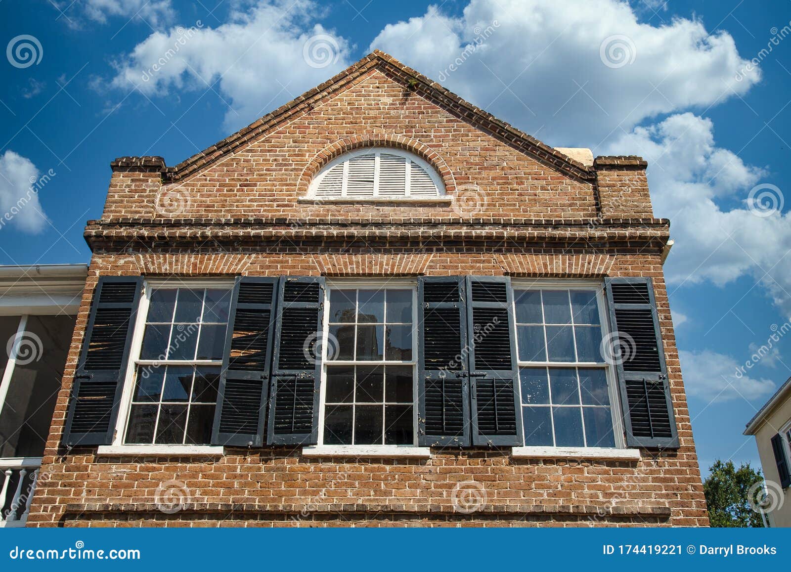 Three Windows with Black Shutters in Old Brick Stock Image - Image of ...